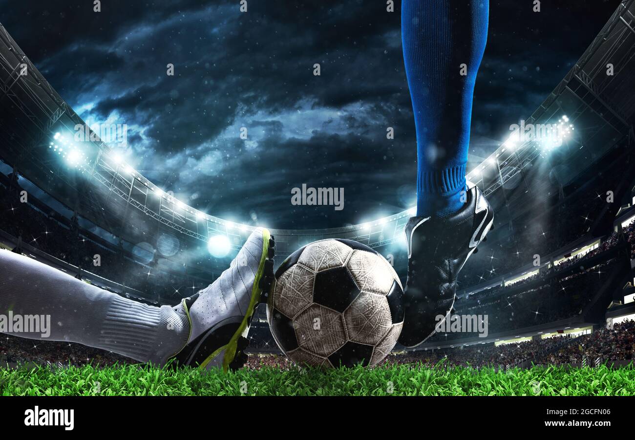 Close up of a football action scene with competing soccer players at ...