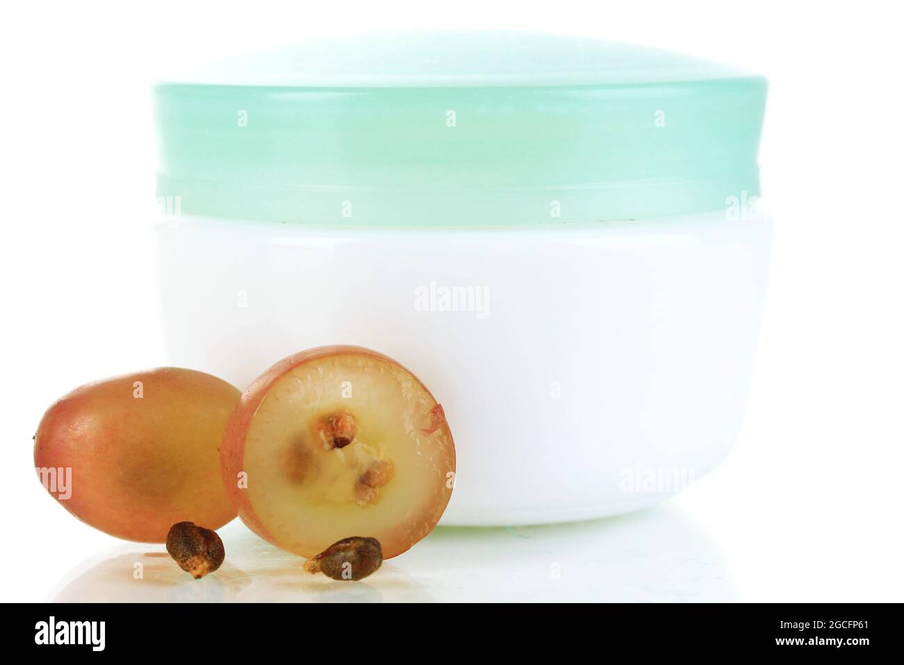 Cosmetic cream and sliced grape, isolated on white Stock Photo - Alamy