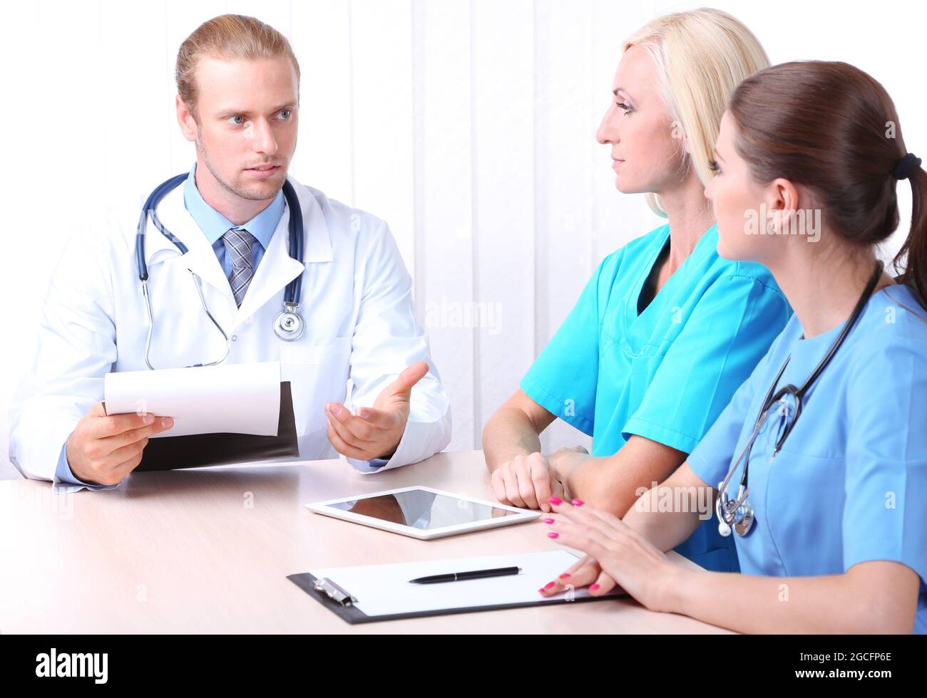 Medical team during meeting in office Stock Photo - Alamy