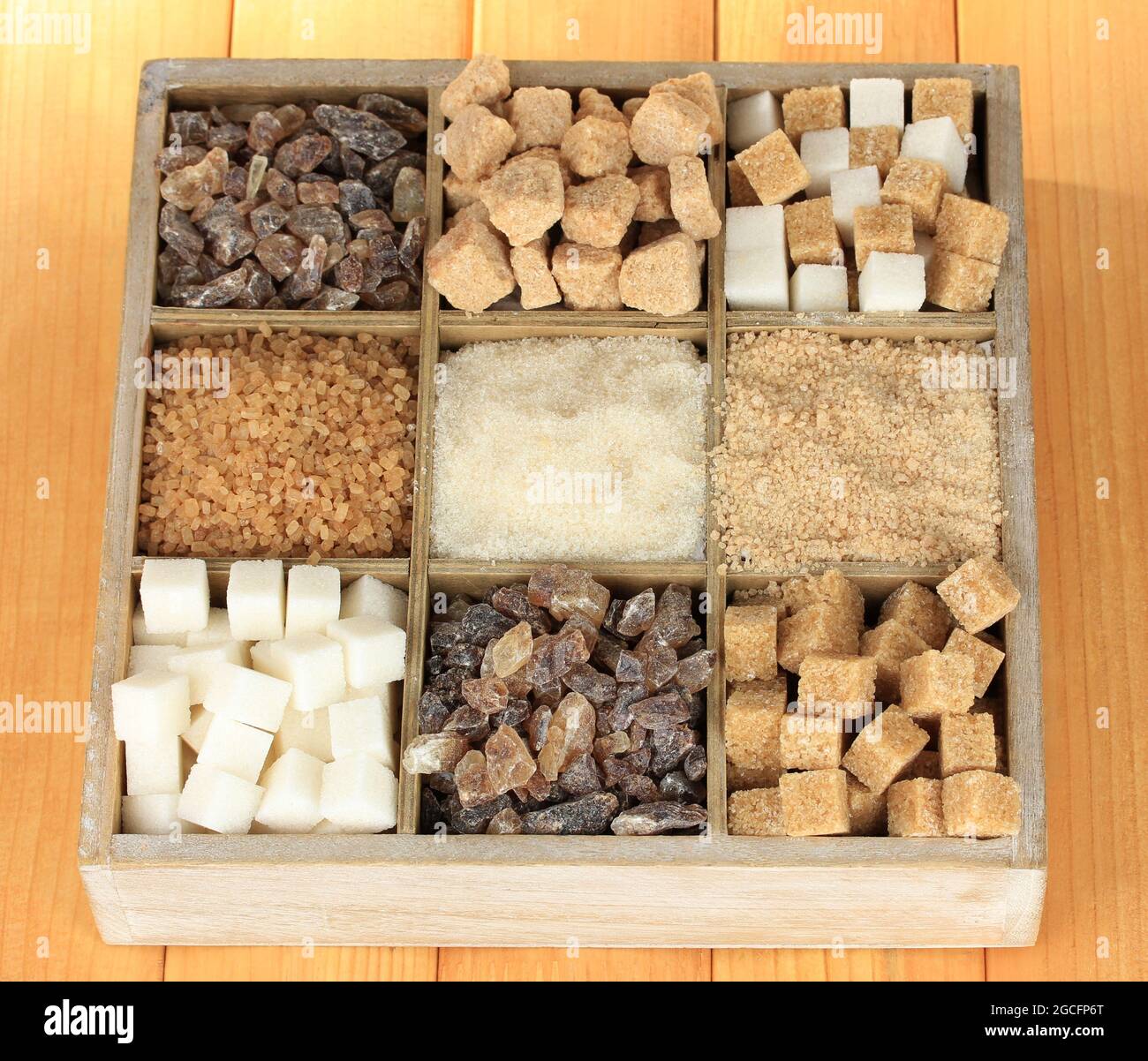 Different types of sugar in wooden box on table close-up Stock Photo ...