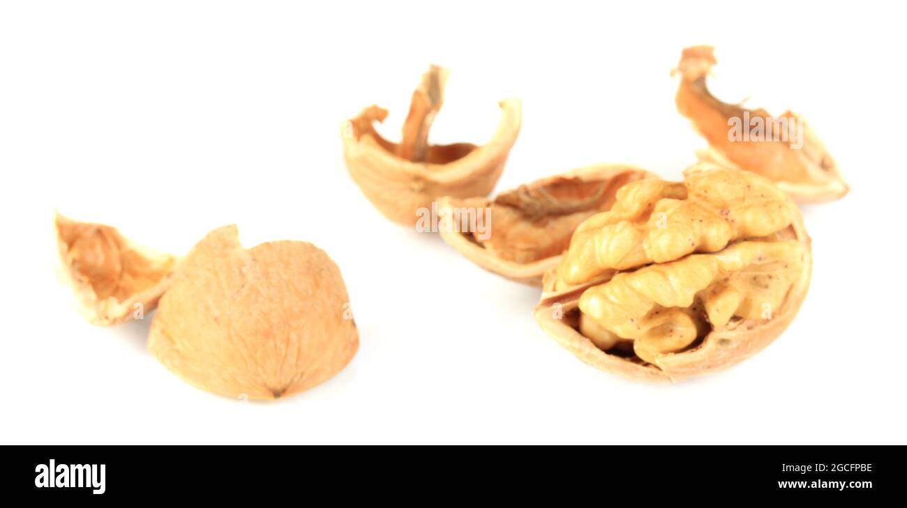 Broken walnut isolated on white Stock Photo - Alamy