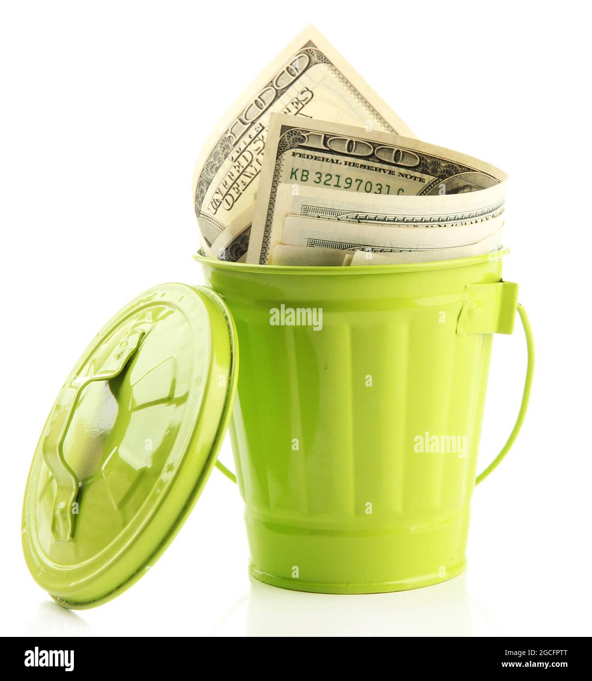 Money in trash can, isolated on white Stock Photo - Alamy