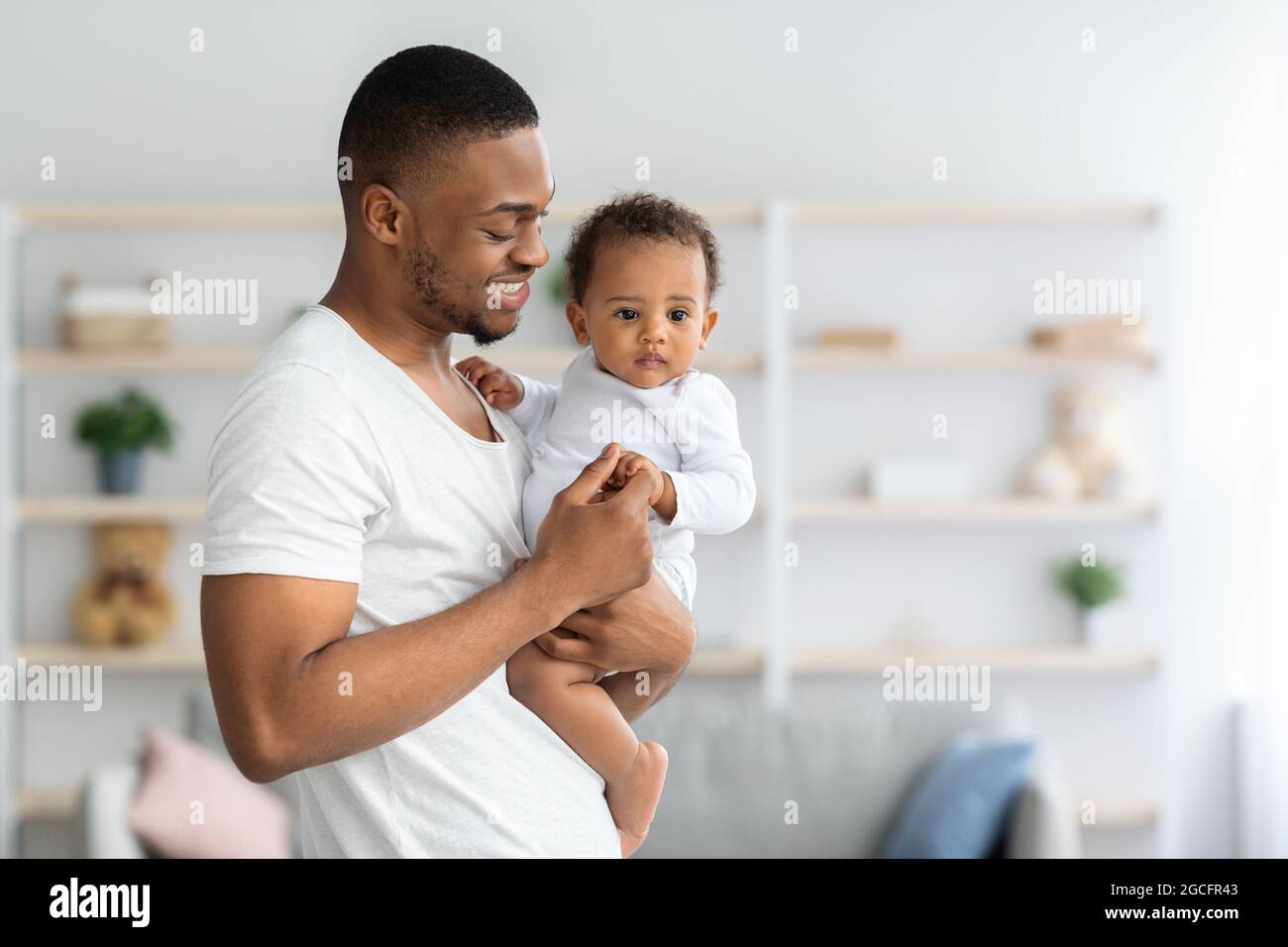 Happy African American Father Posing With Infant Baby At Home, Caring ...