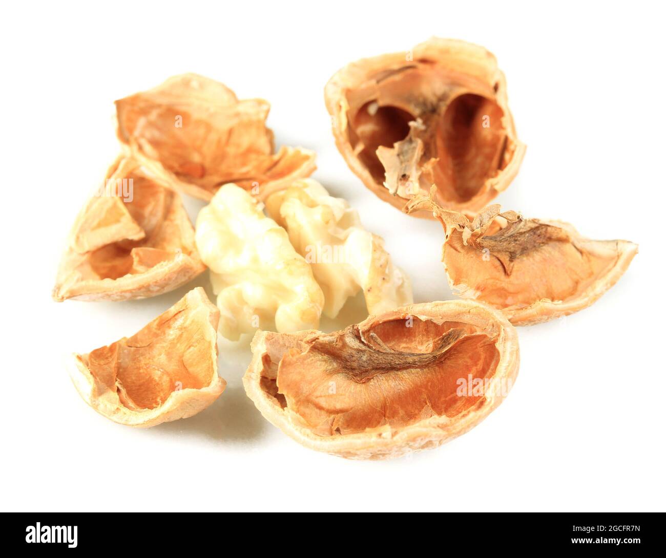 Broken walnut isolated on white Stock Photo - Alamy