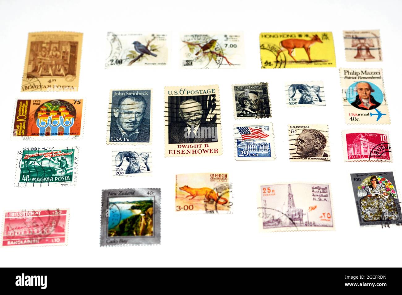 background of various old used postage stamps from different countries ...