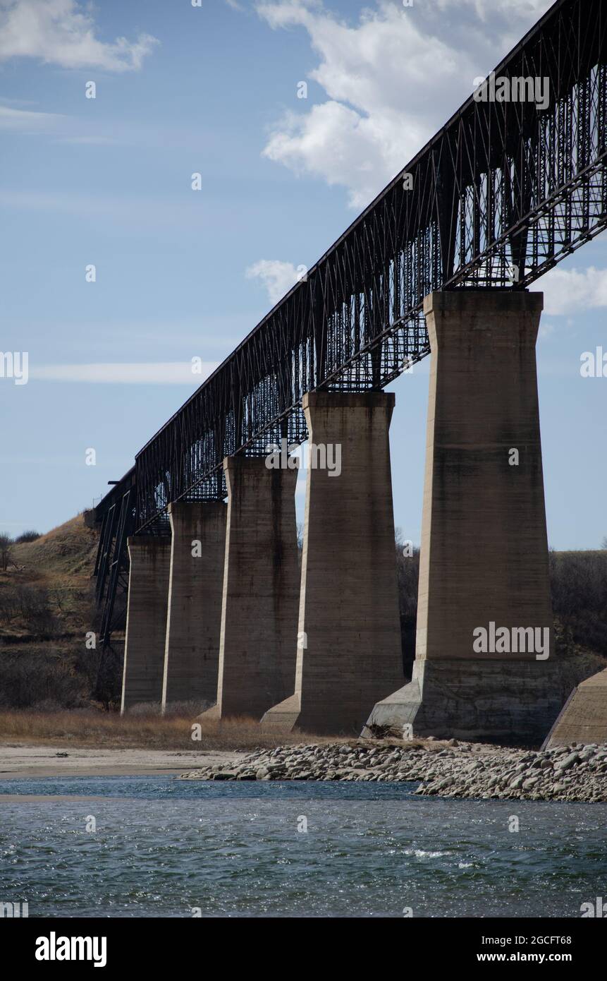 A vertical shot of a beautiful metal bride with stone columns and a ...