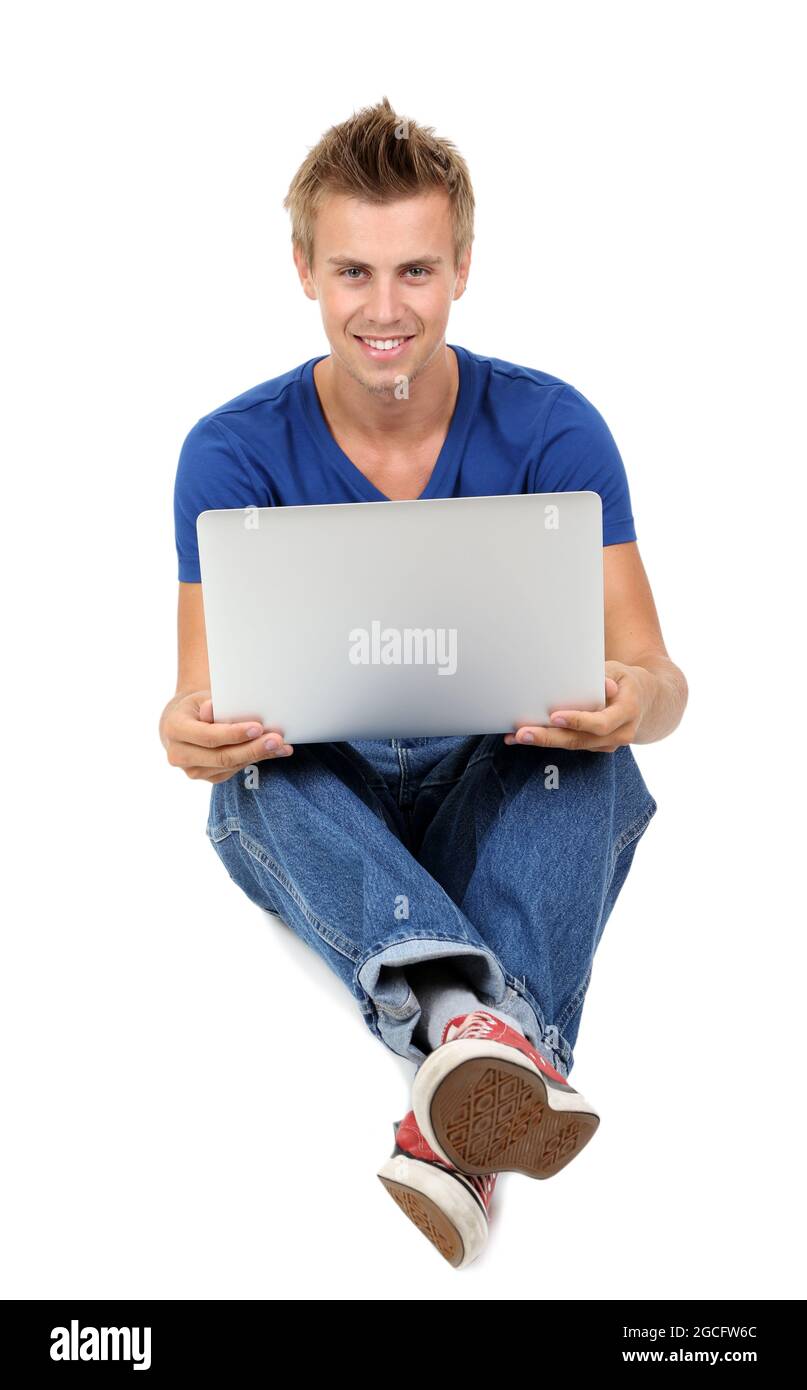 A handsome young man with laptop isolated on white Stock Photo - Alamy