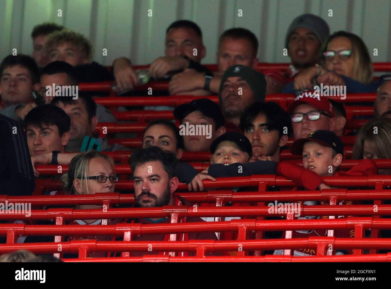 Liverpool, England, 8th August 2021. Fans sit in new terraced seating ...