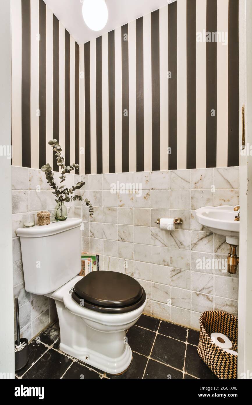 Interior of small clean washroom in miniature style Stock Photo - Alamy