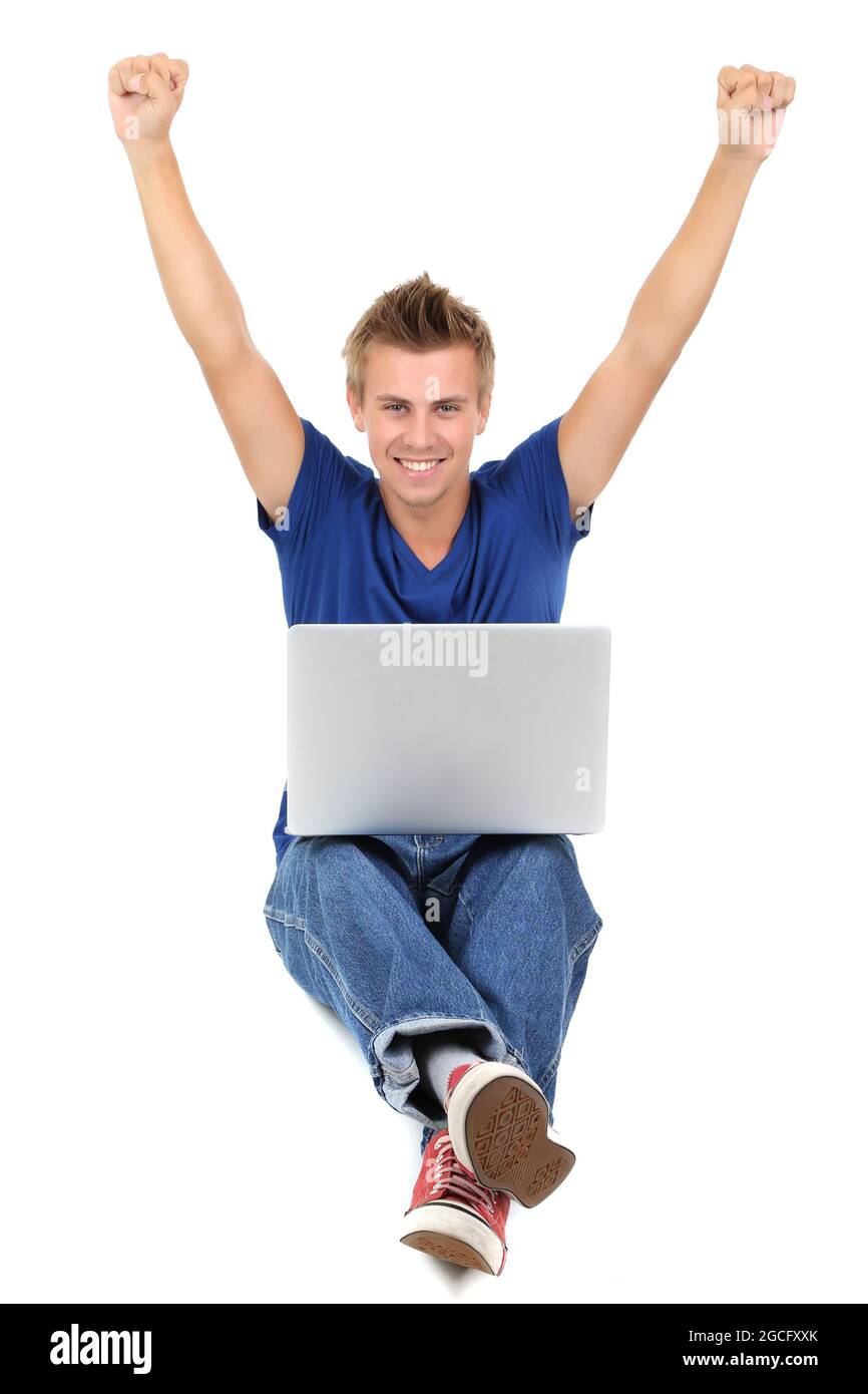 A handsome young man with laptop isolated on white Stock Photo - Alamy