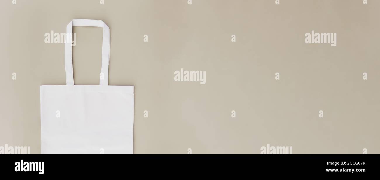 Eco white craft paper bag flat lay banner on beige background with copy ...