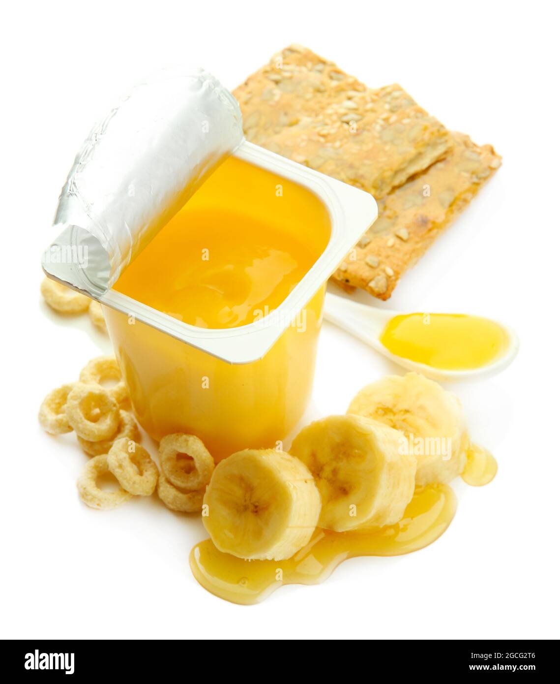 Tasty dessert in open plastic cup and banana, isolated on white Stock ...