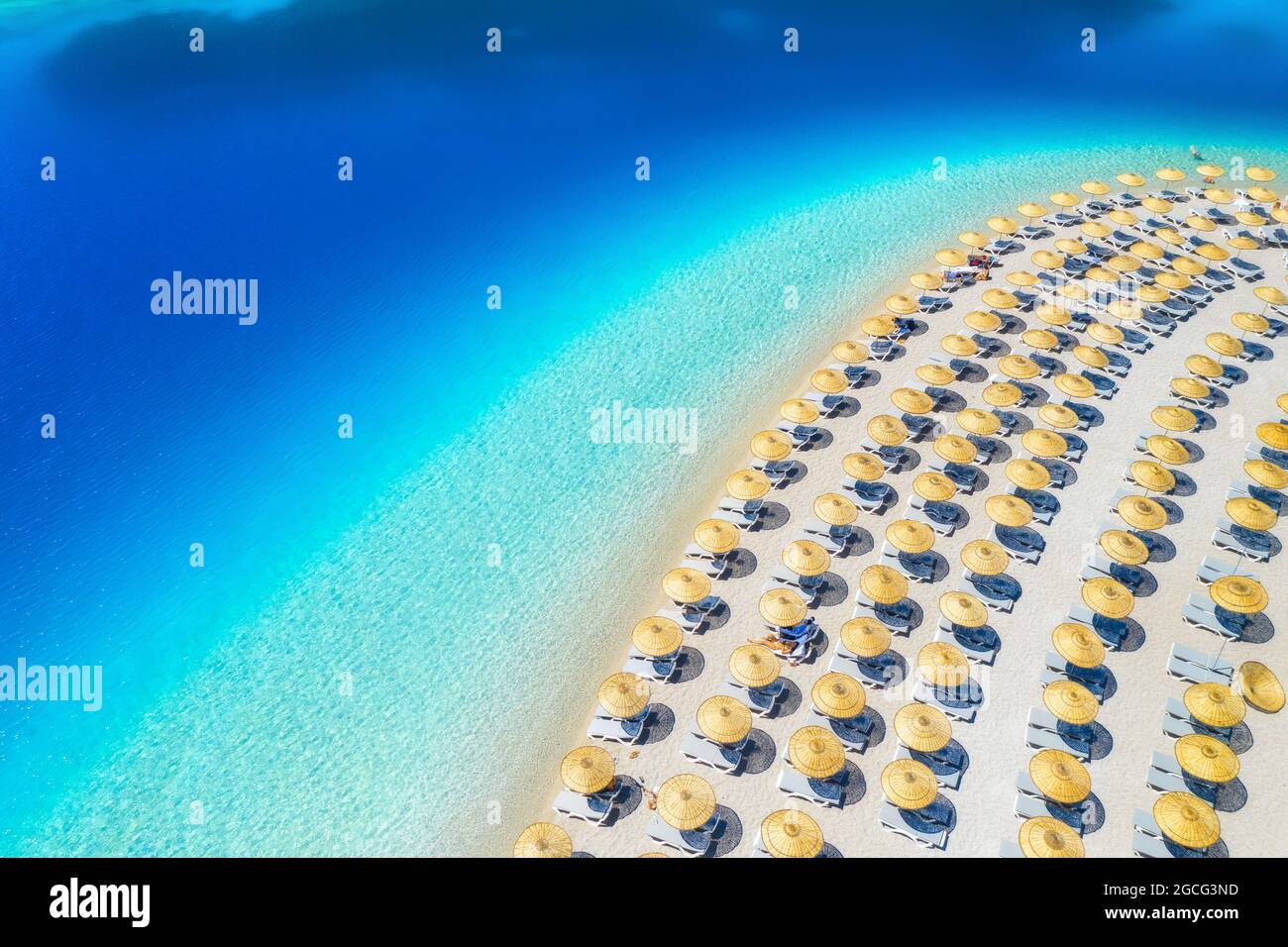 Aerial view of sea, empty sandy beach with sunbeds and umbrellas Stock ...