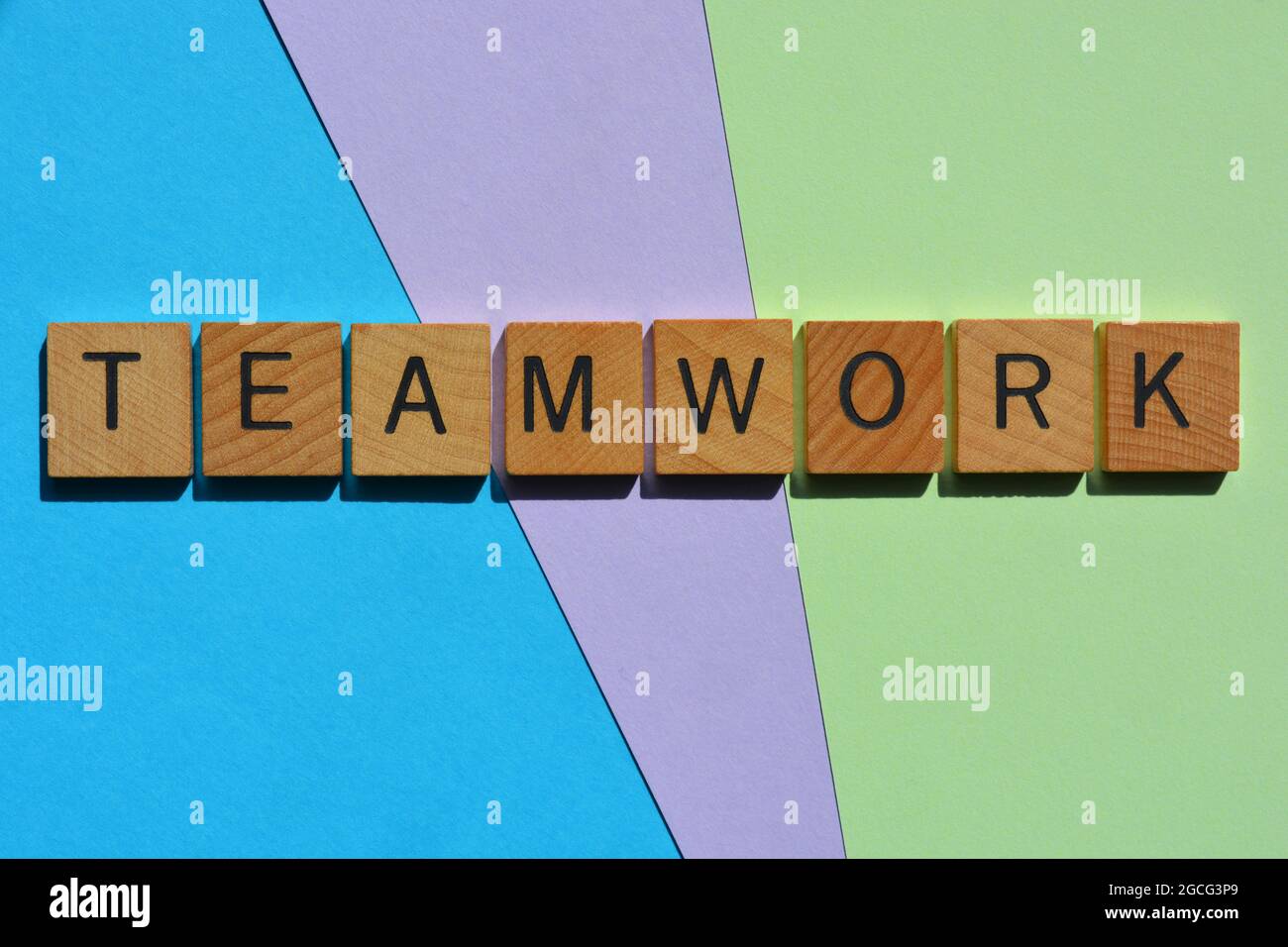 Teamwork, word in wooden alphabet letters isolated on colourful ...