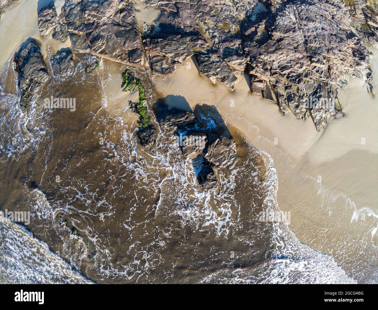 Aerial view of sand, waves and rocks at Torres beach, Torres, Rio ...