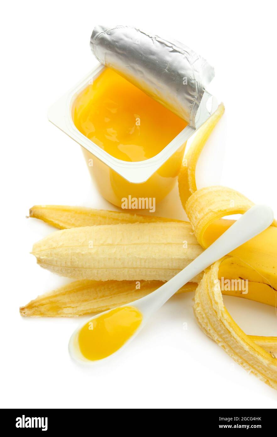 Tasty dessert in open plastic cup and banana, isolated on white Stock ...