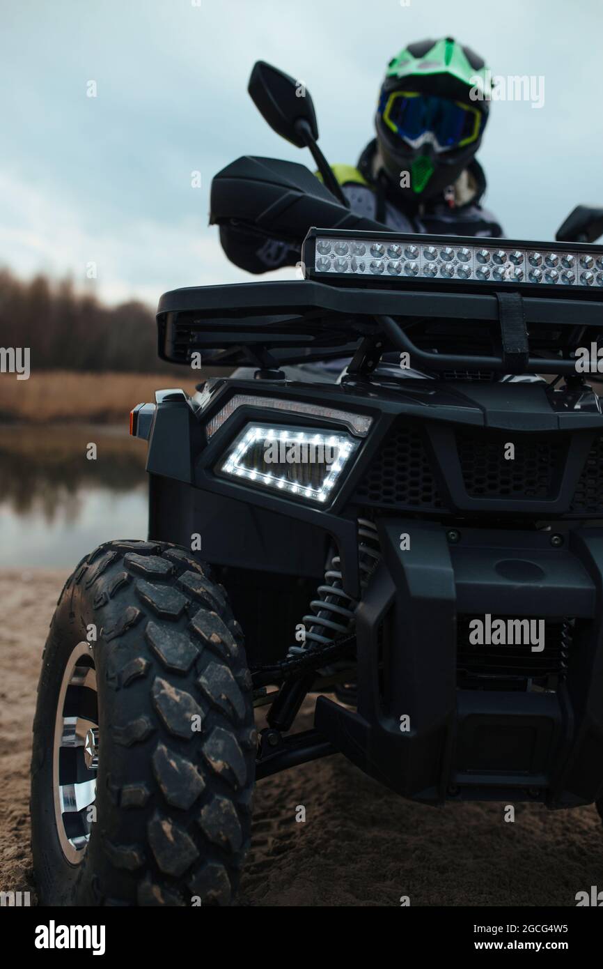 Driver sits on quad hi-res stock photography and images - Alamy