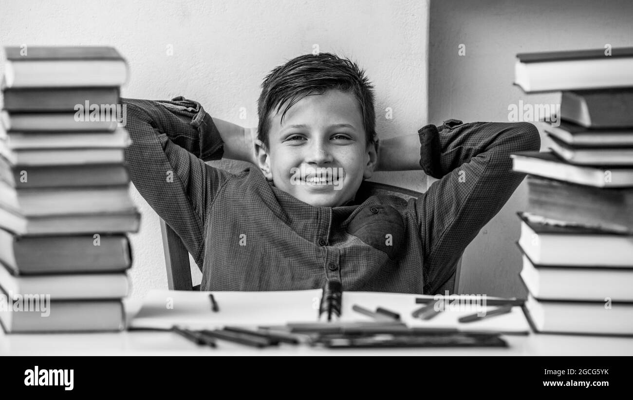 Elementary school student doing homework. Black and white photo Stock ...