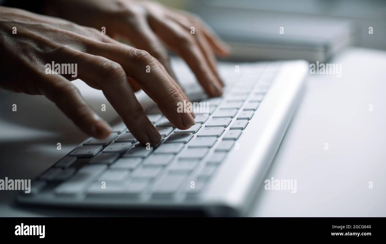 Hands typing on the keyboard in the office Stock Photo - Alamy