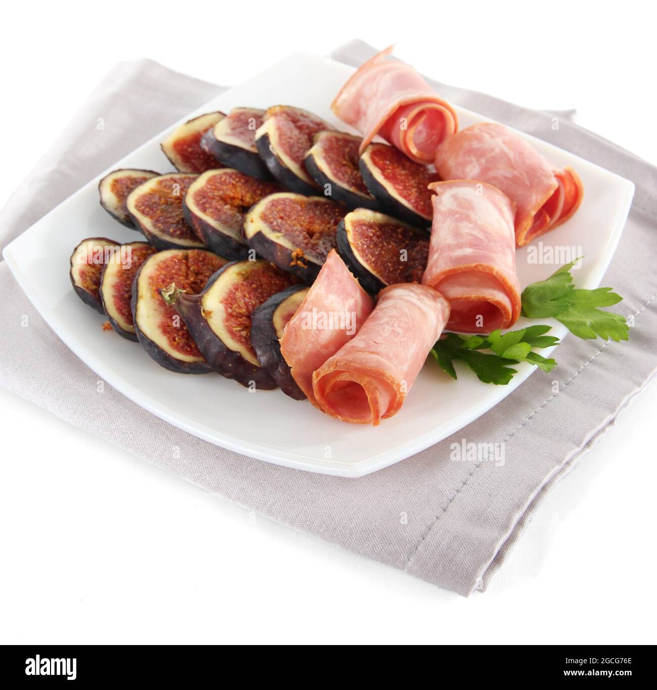 Tasty figs with ham, isolated on white Stock Photo - Alamy