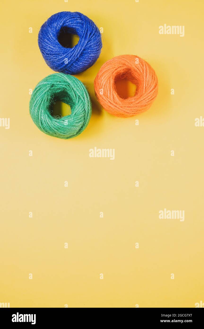 A closeup shot of soft colorful textile balls of wool on a ...