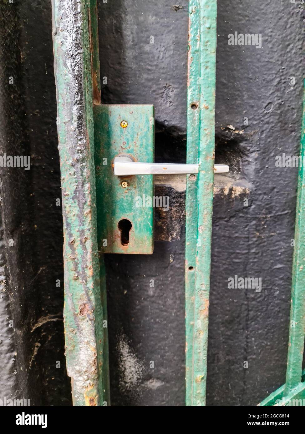 Close up of a metal lock at a closed Door Stock Photo - Alamy