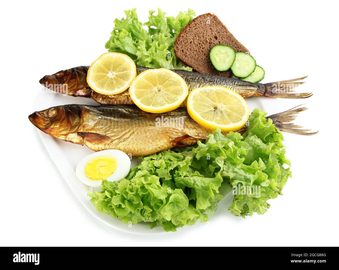 Smoked fish on plate isolated on white Stock Photo - Alamy