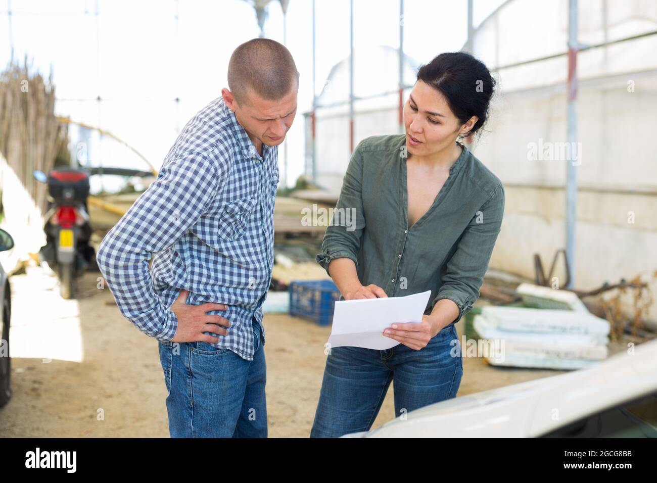 Farmer signing contract with representative of transport company Stock ...