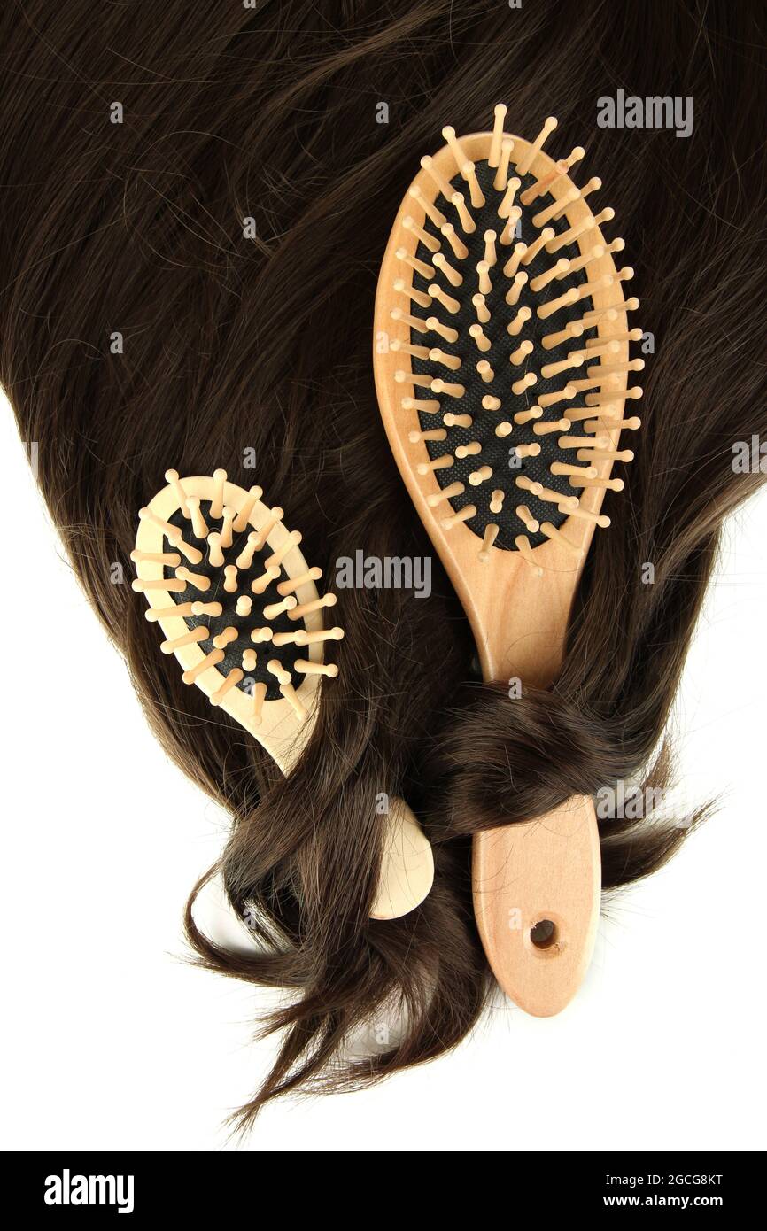 Shiny brown hair with combs isolated on white Stock Photo - Alamy