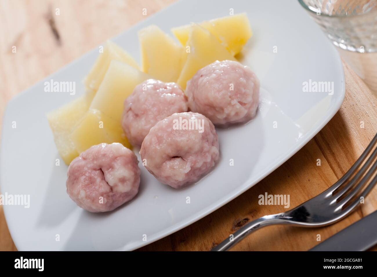 Steamed meatballs with potatoes Stock Photo - Alamy