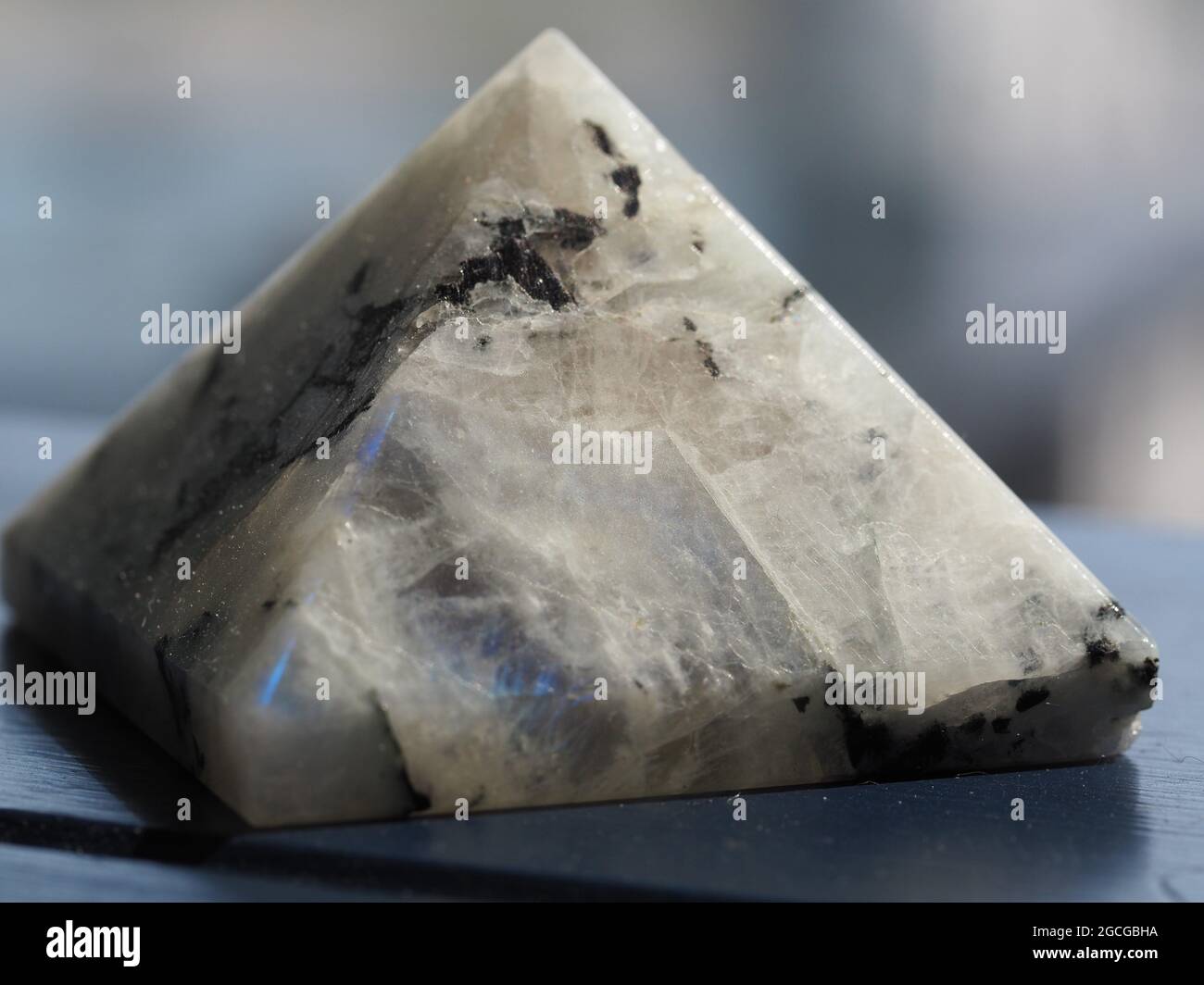 Moonstone with Black and Rainbow Inclusions Stock Photo - Alamy