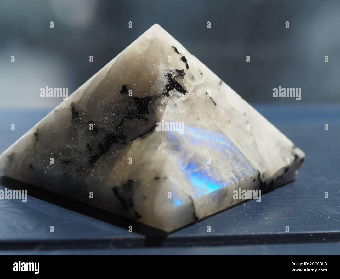 Moonstone with Black and Rainbow Inclusions Stock Photo - Alamy