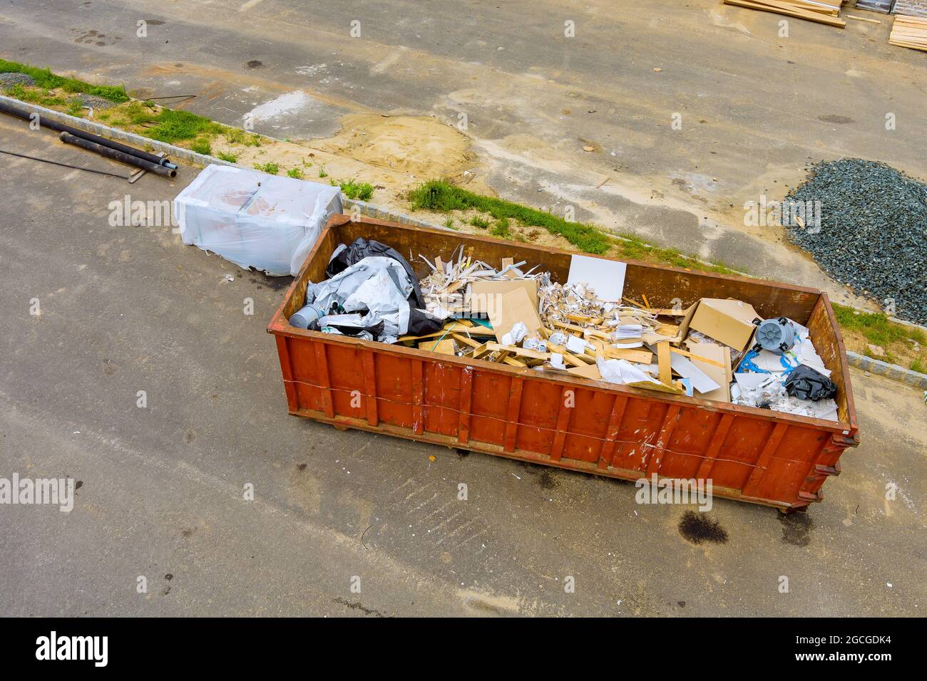 Construction trash garbage dumpsters on metal container house ...