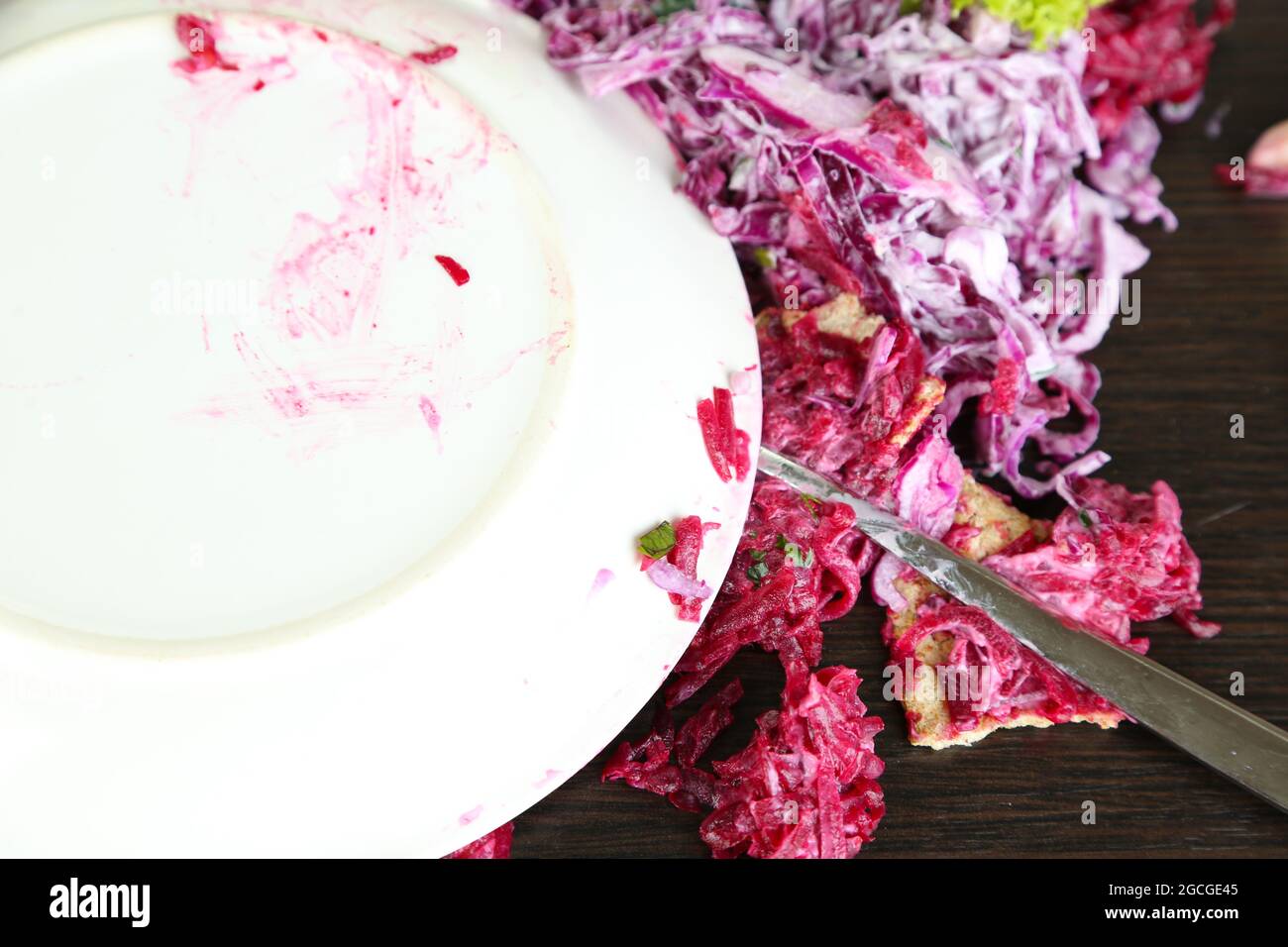 Overturned plate of food on floor Stock Photo - Alamy