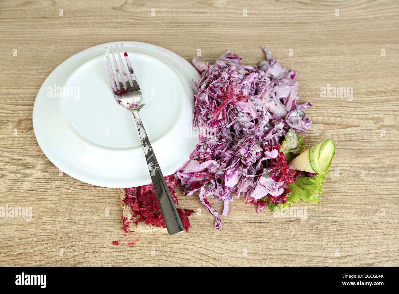 Overturned plate of food on floor Stock Photo - Alamy