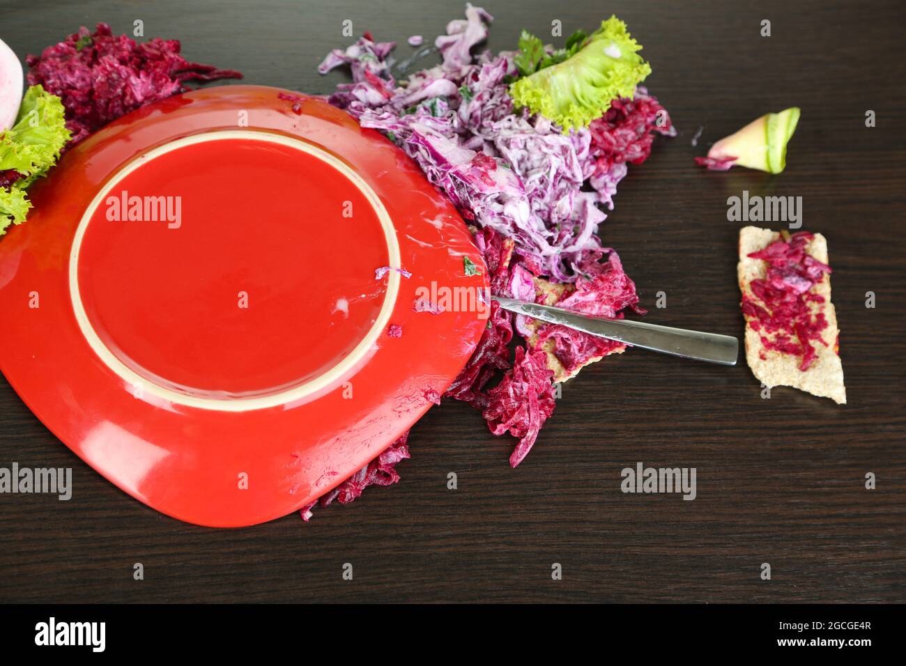Overturned plate of food on floor Stock Photo - Alamy