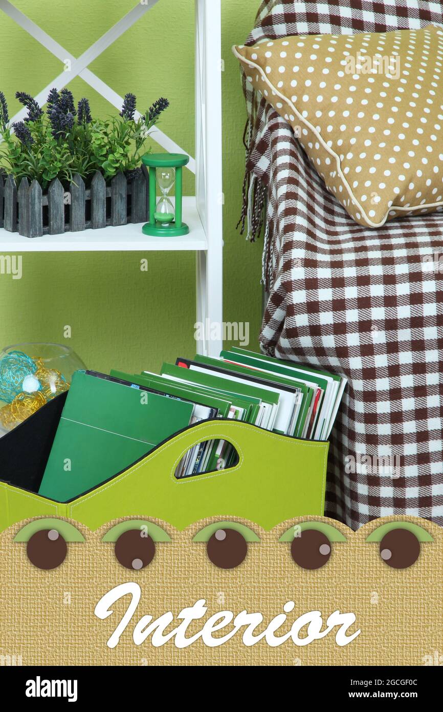 Magazines and folders in green box on floor in room Stock Photo - Alamy