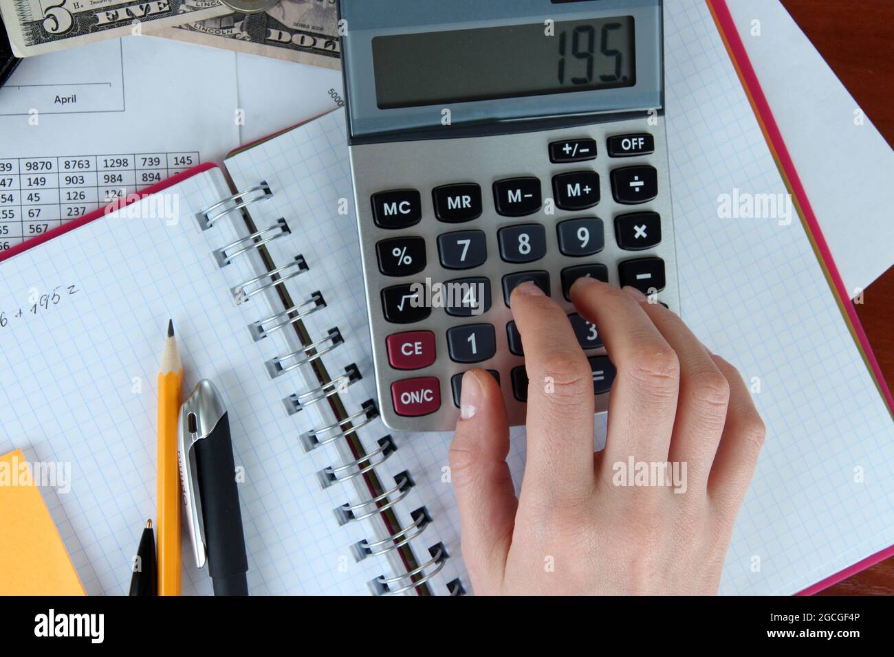 Woman hand counting on calculator on worktable background Stock Photo ...