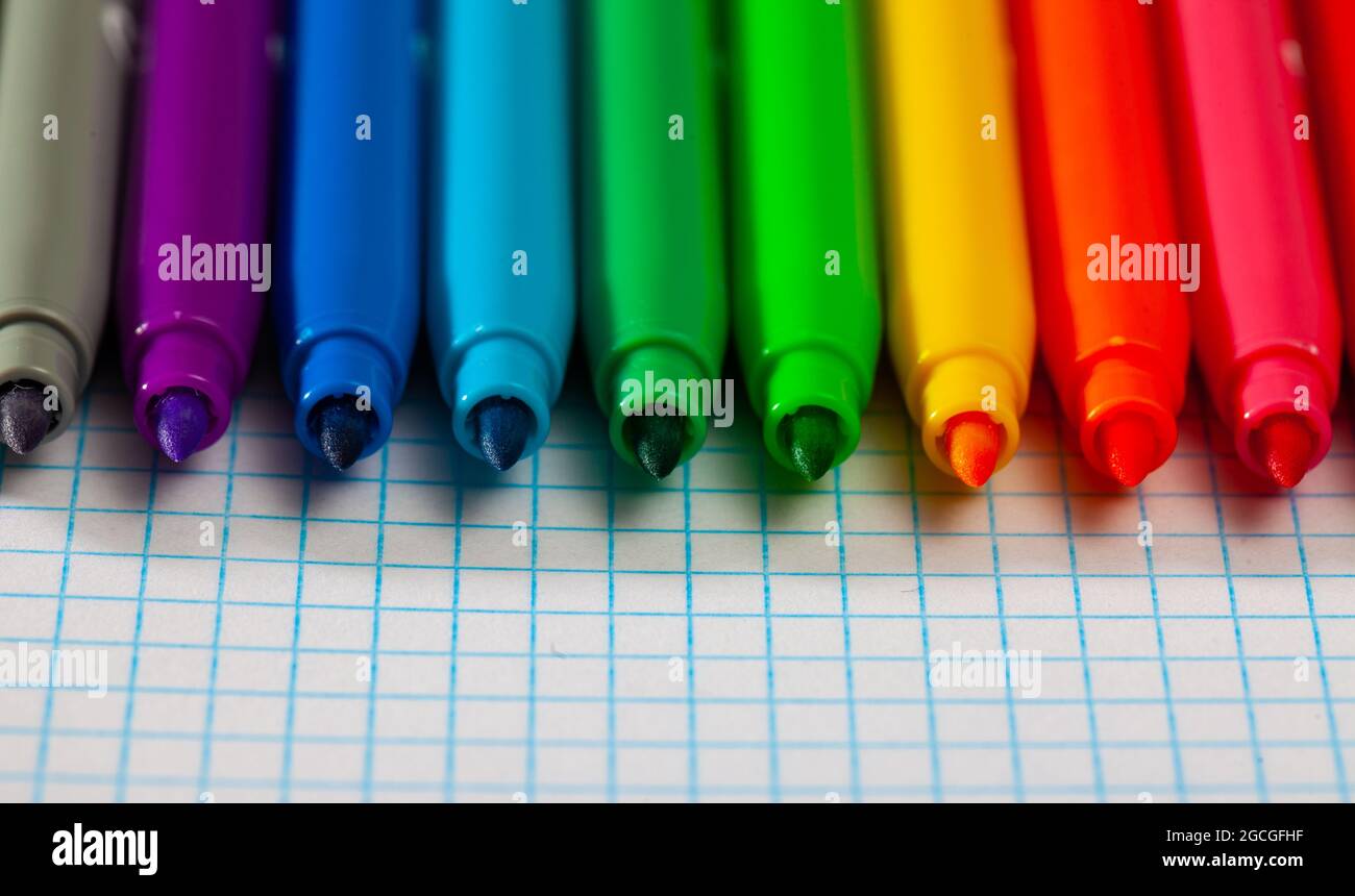 Many various felt tip pens on checkered sheet of paper Stock Photo - Alamy