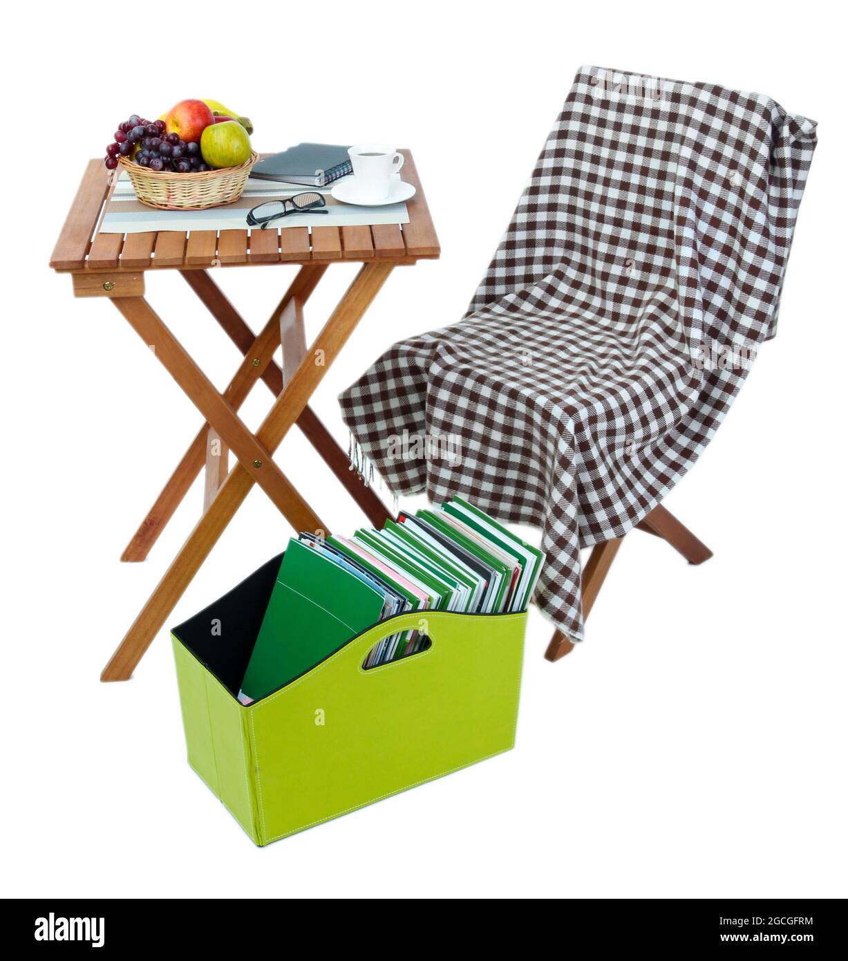 Magazines and folders in green box isolated on white Stock Photo - Alamy