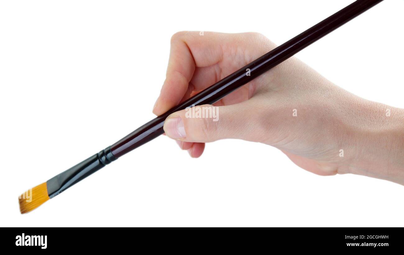 Paint brush in hand isolated on white Stock Photo - Alamy