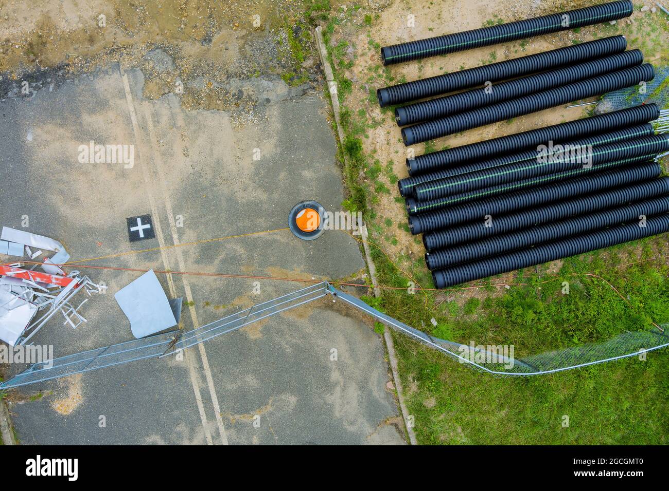 Plastic main black pipes on heap of polyethylene pipes for a water ...