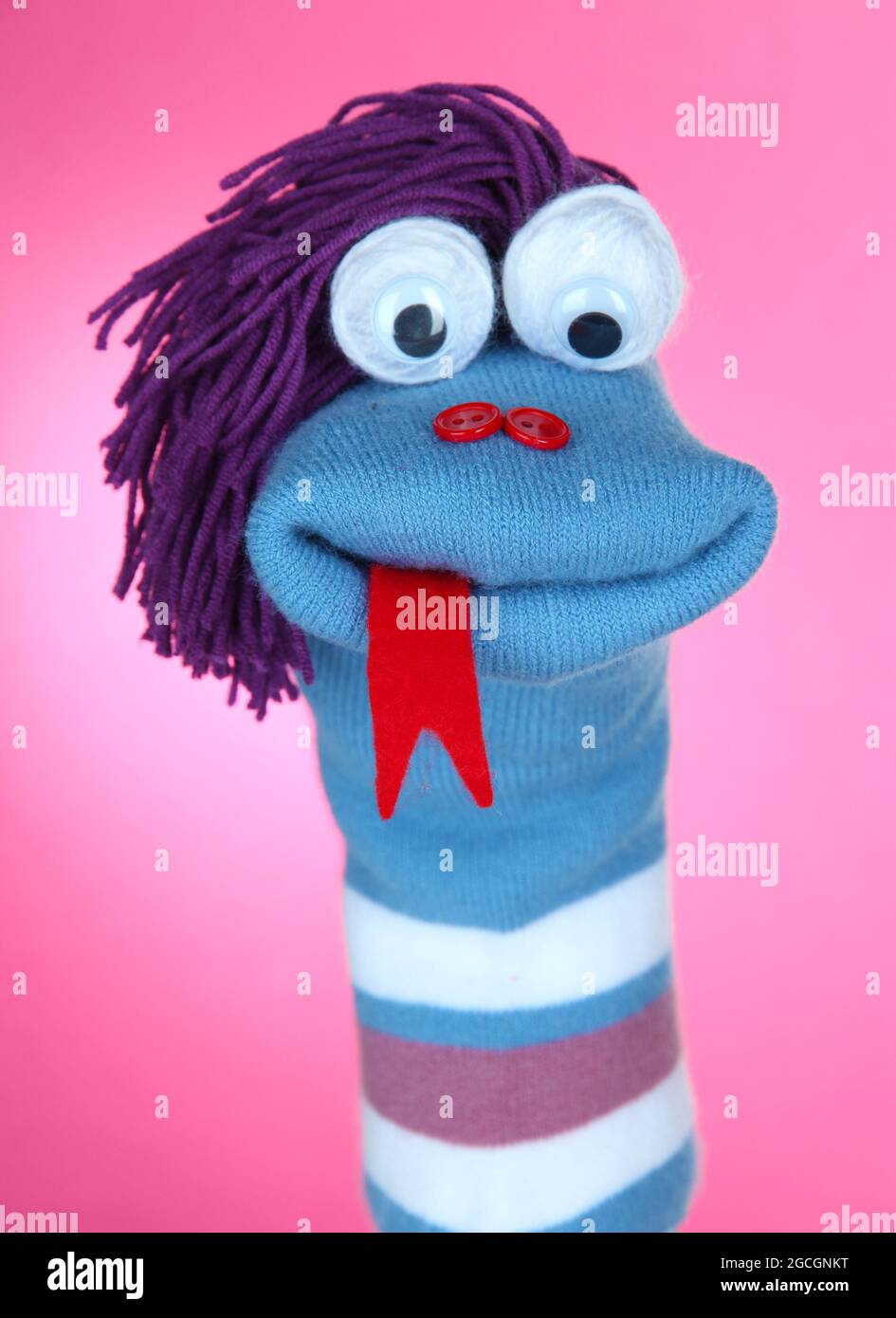 Cute sock puppet on pink background Stock Photo - Alamy