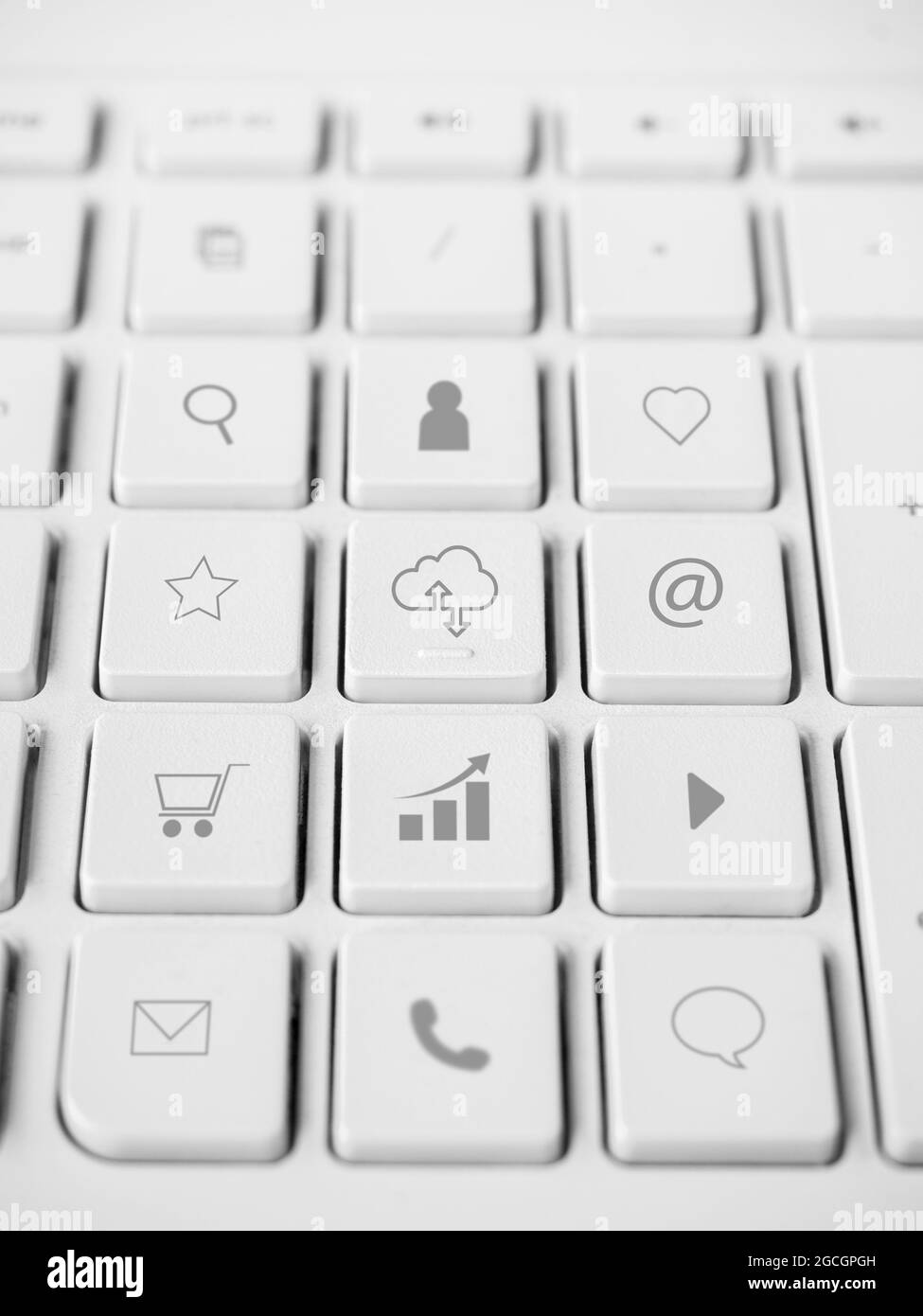 Business and economy icons on white clean buttons on computer keyboard ...