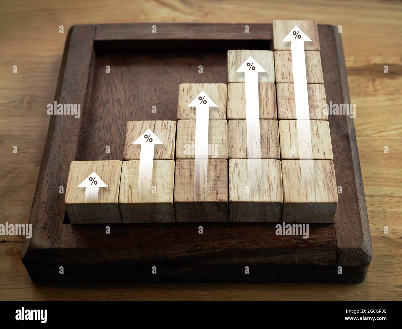 Rising up arrows on wooden blocks chart steps with percentage icons on ...