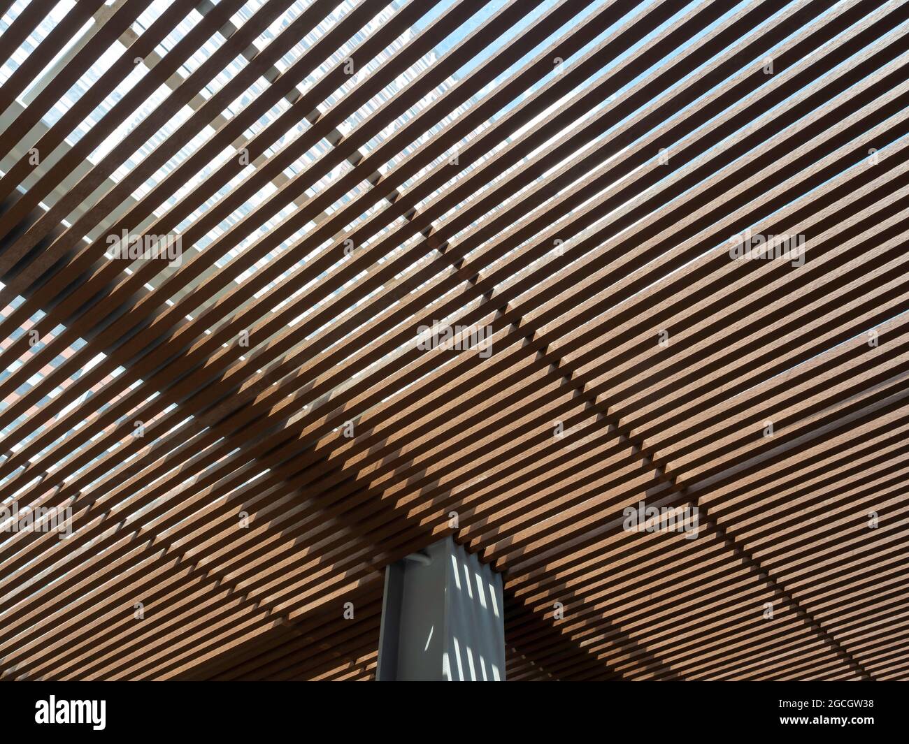Wooden slats roof, architecture construction with sunlight streaming ...