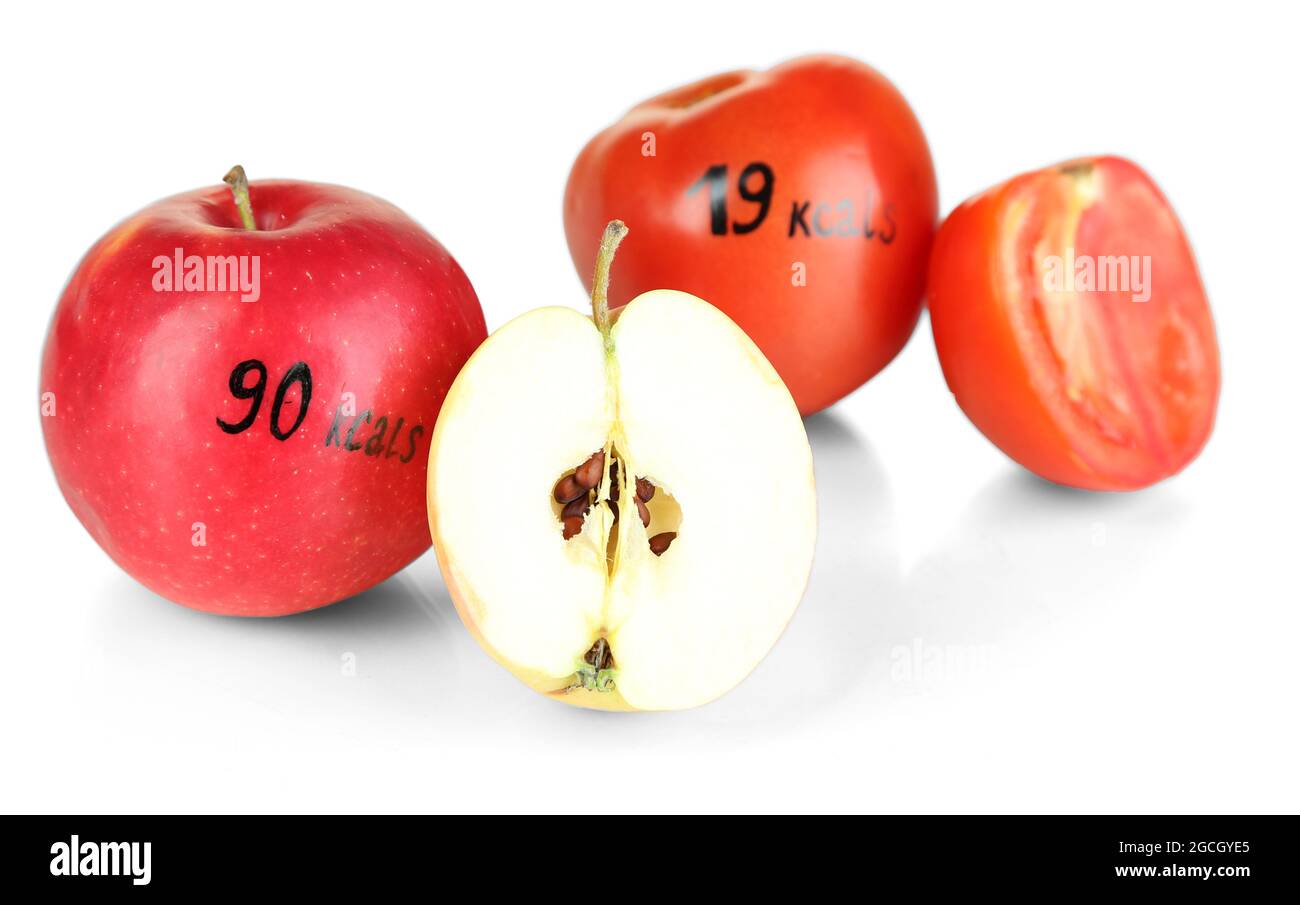 Calorie content of apple and tomato isolated on white Stock Photo - Alamy