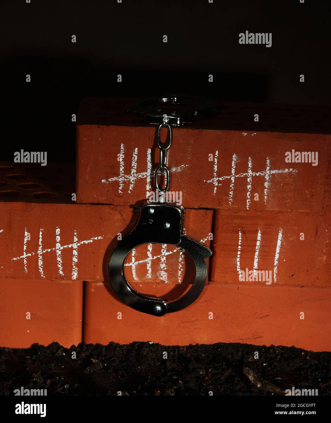 Counting days by drawing sticks on bricks on dark background Stock ...