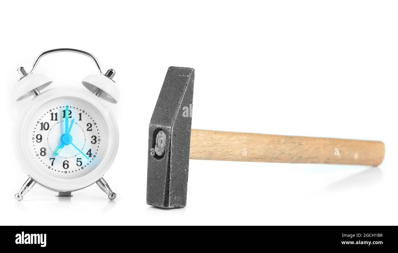 Hammer and alarm clock isolated on white Stock Photo - Alamy