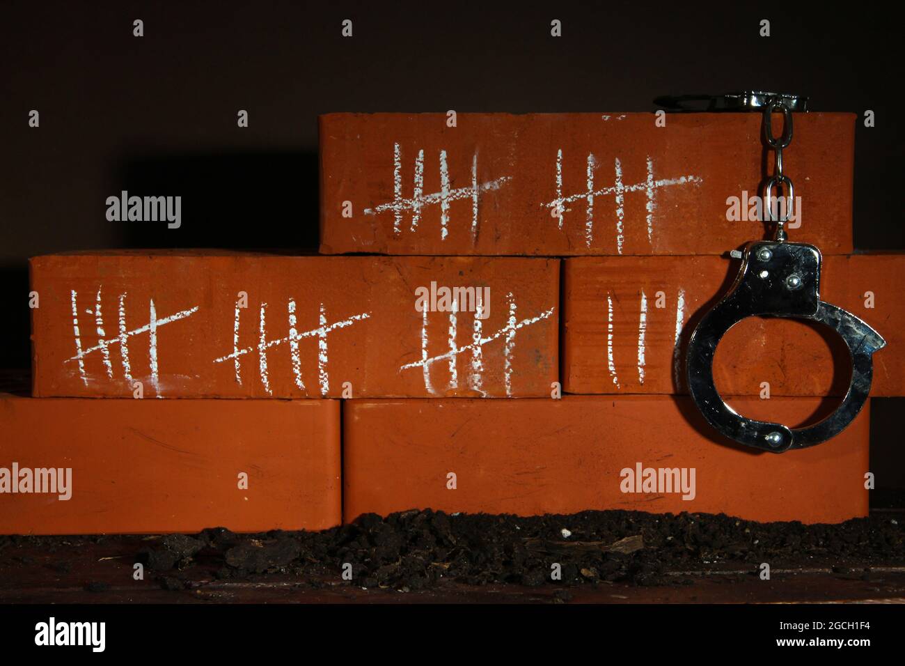 Counting days by drawing sticks on bricks on dark background Stock ...